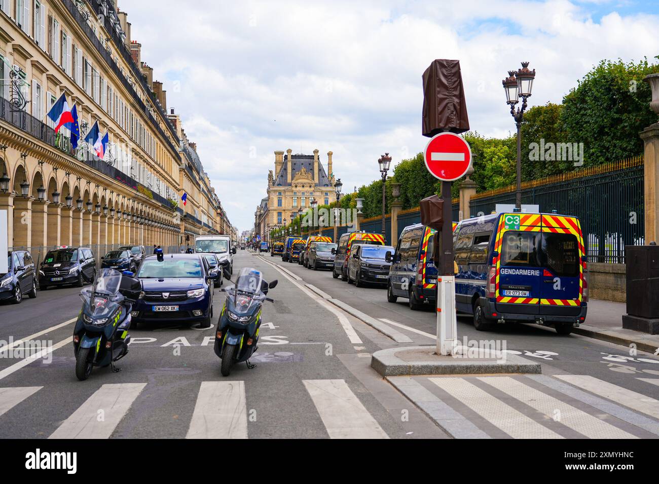 Law enforcement vehicles parked on the Rue de Rivoli along the Jardins ...
