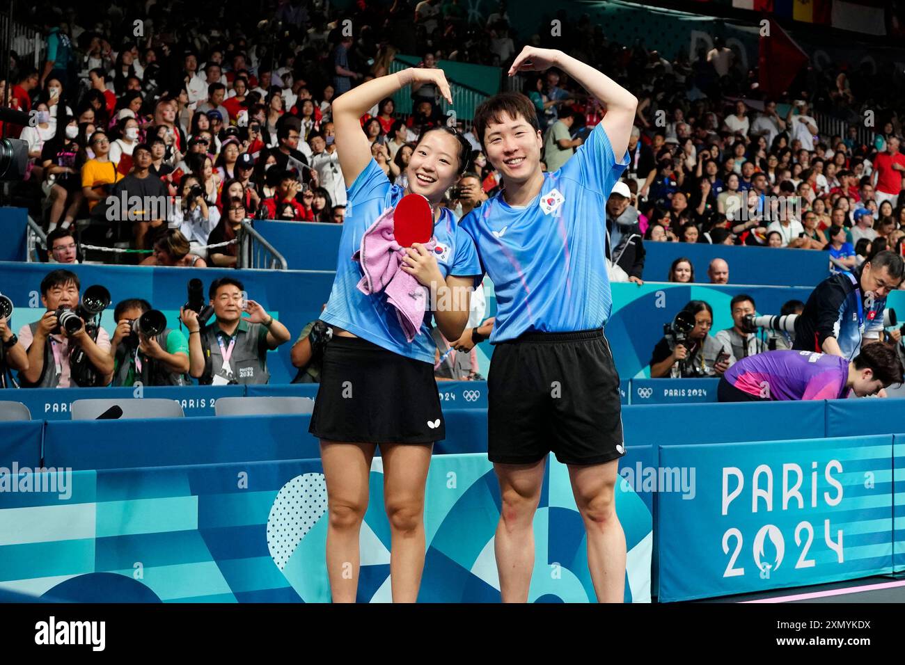 South Korea's Shin Yubin, left, and Lim Jonghoon celebrate their win against Hong Kong's Doo Hoi ...