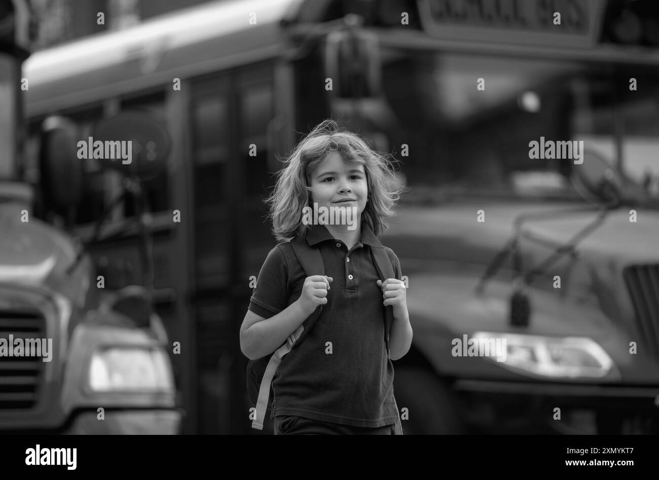 Schoolchild getting on the school bus. American School. Back to school ...