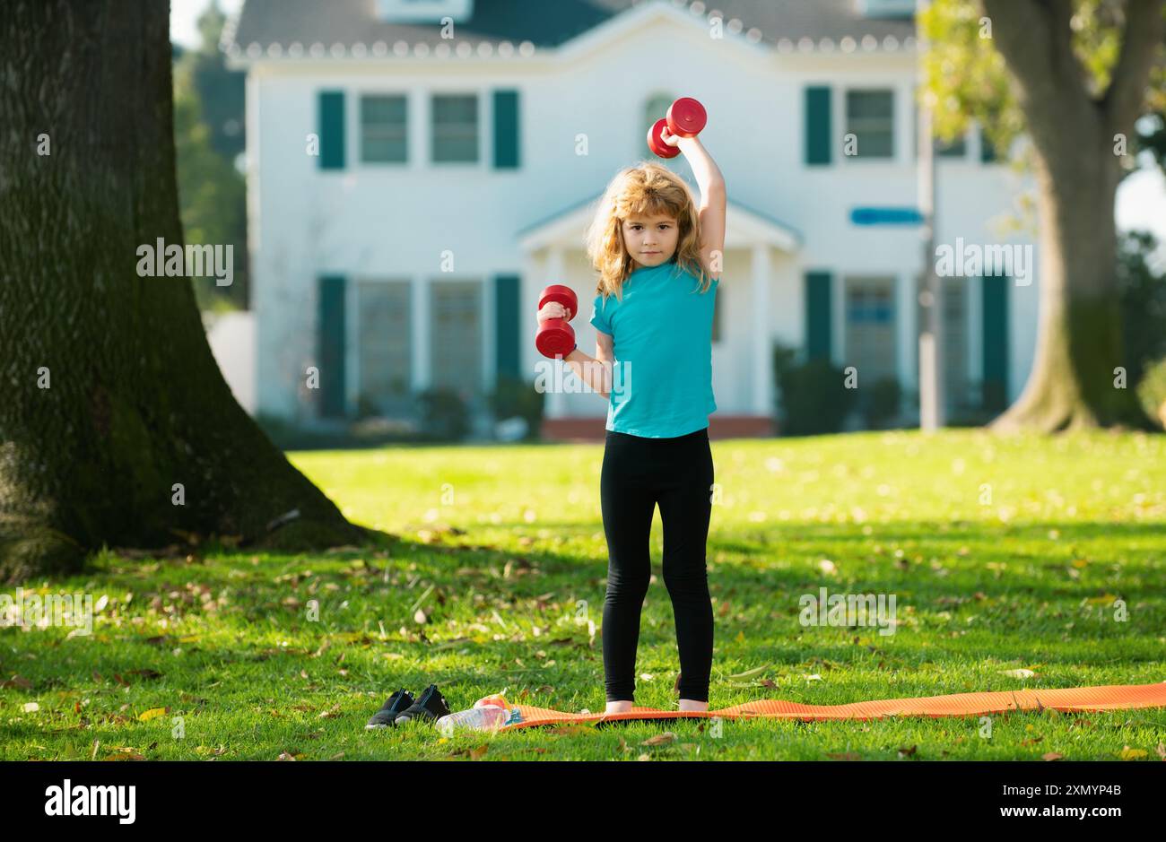 Children having workout. Sport kids activities outdoor. Child raising a ...