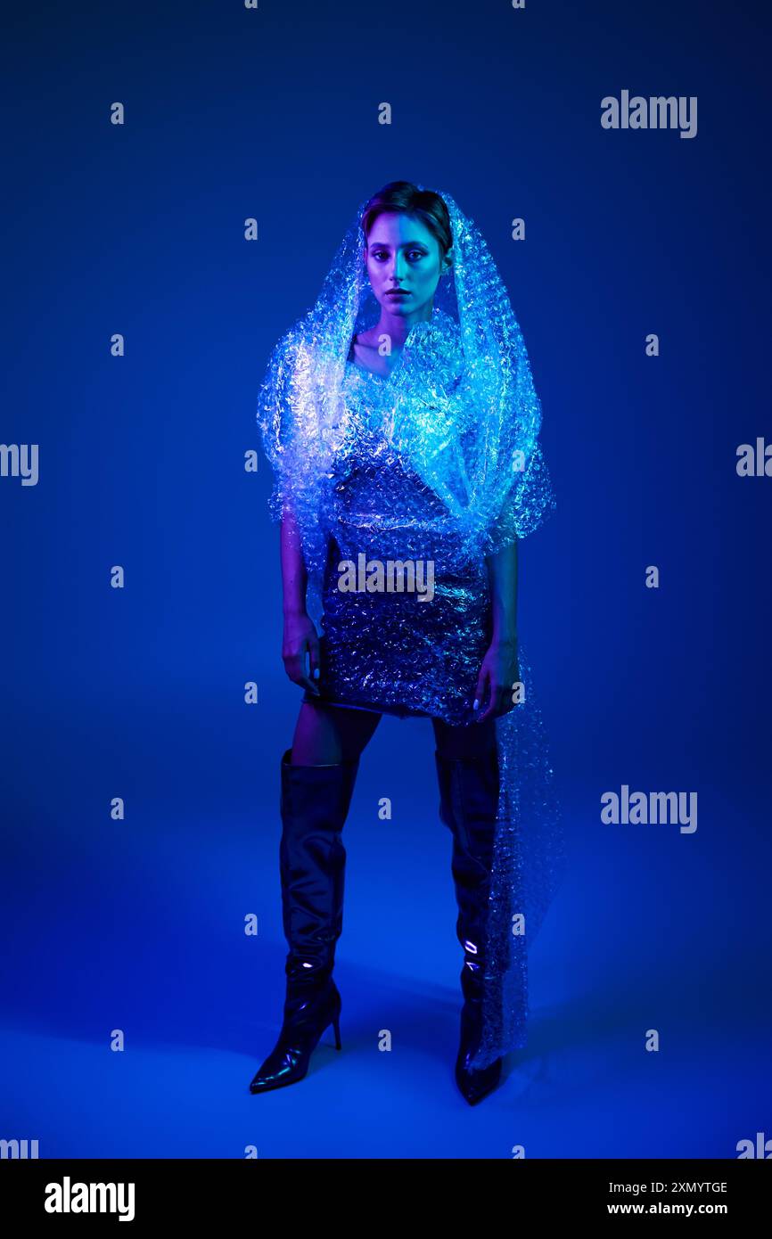 Woman confidently wears bubble wrap dress in studio, showcasing ...