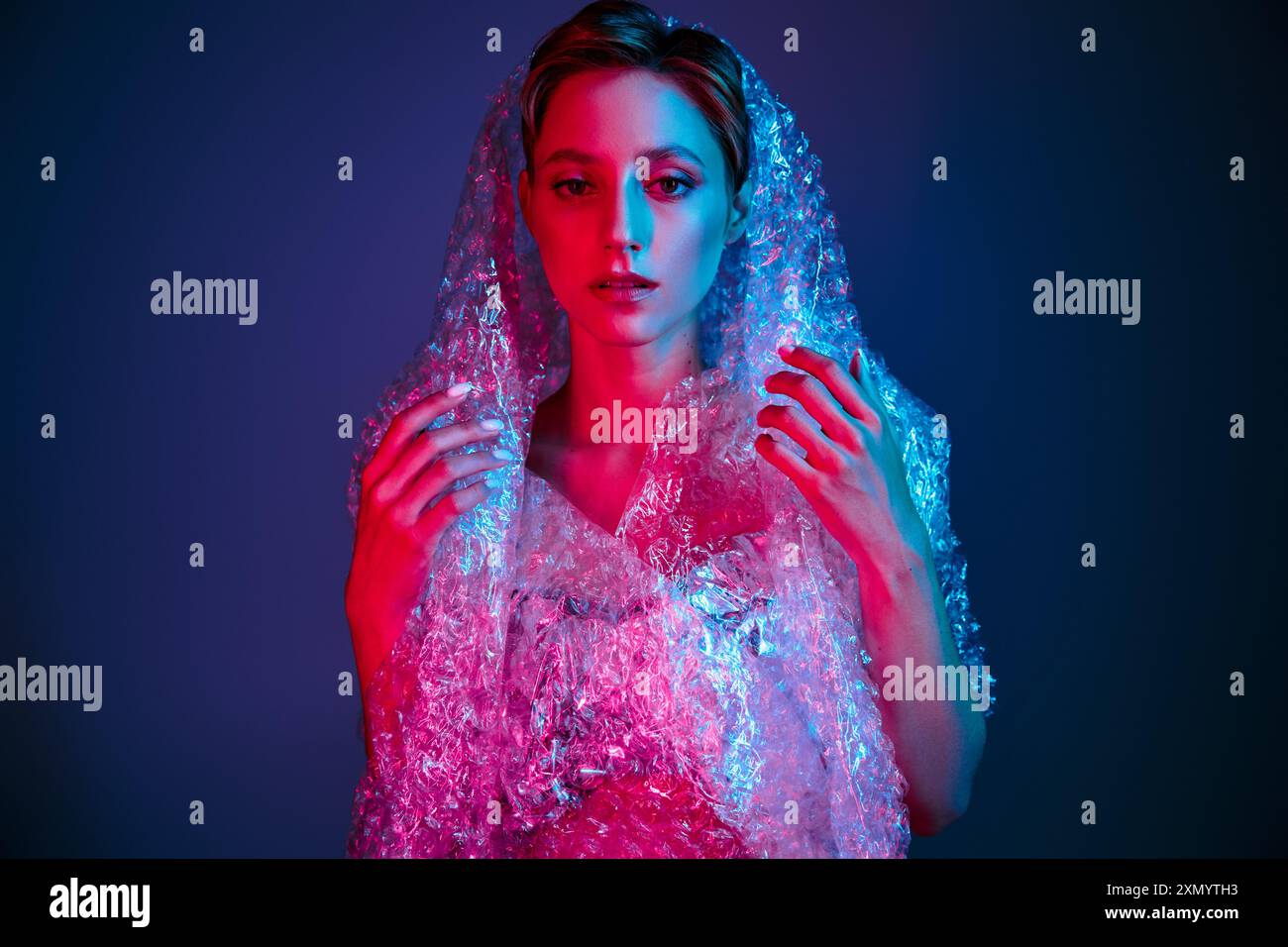 Woman with bubble wrap-covered body lit by red and blue light Stock ...