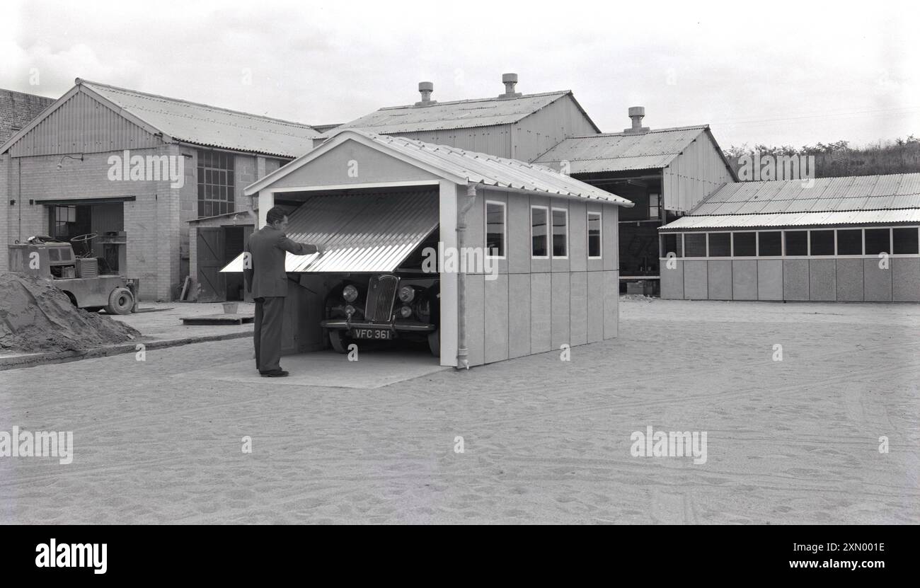 1950s, historical, man, prefab garage, car of the era inside, Oxford ...
