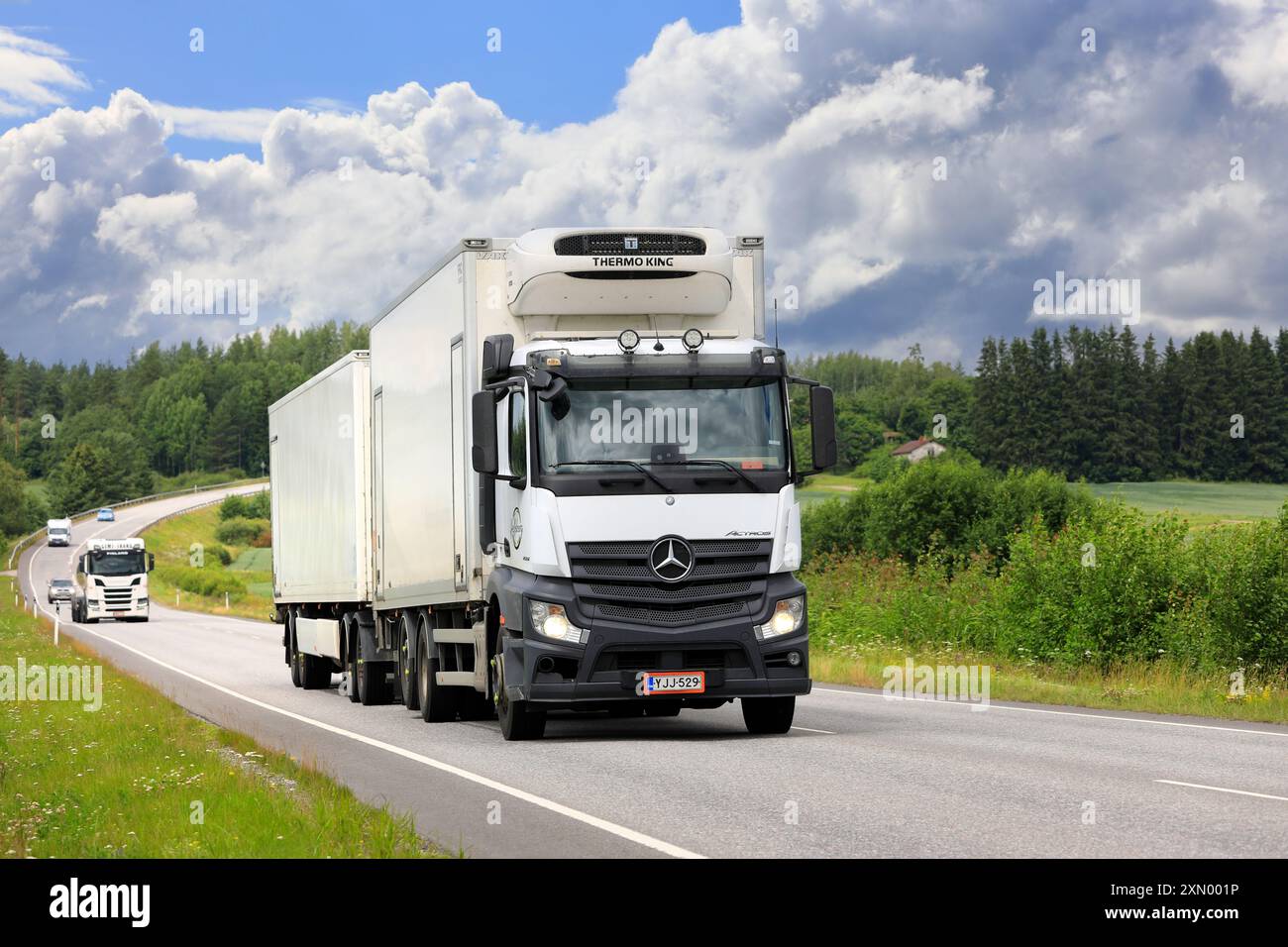 White Mercedes-Benz Actros truck transports goods in Thermo King FRC ...