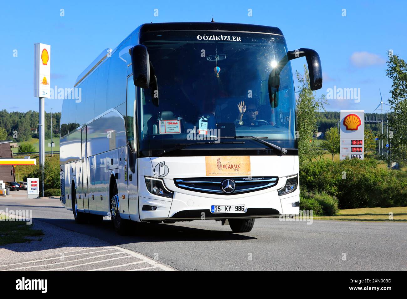 New white Mercedes-Benz Tourismo coach bus, Turkish plates, exits a ...