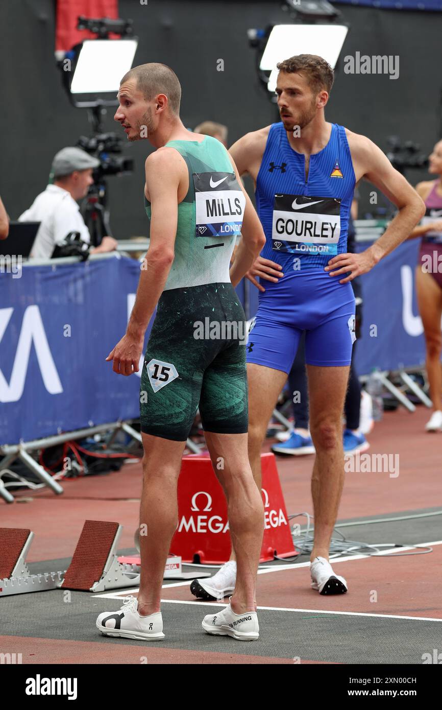 George MILLS speaking to an official after falling in the Emsley Carr ...