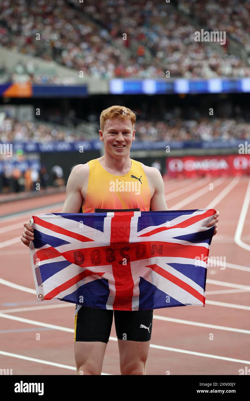 Charlie Dobson celebrating with the Union Jack after setting a personal ...