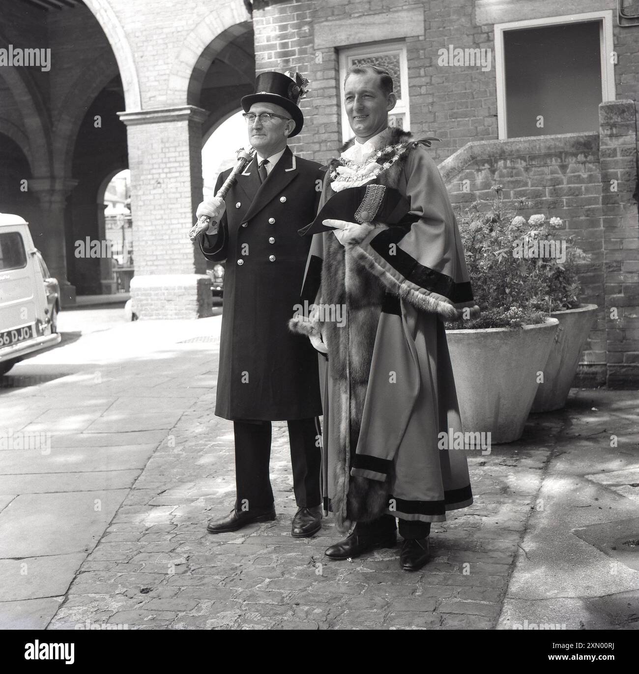 1964, historical, standing outside, a town mayor wearing the ...