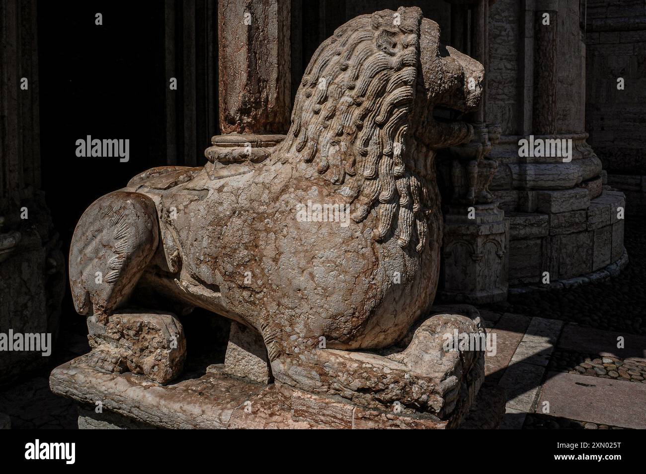 Medieval sculpted lion supports column at south-east portal to ...