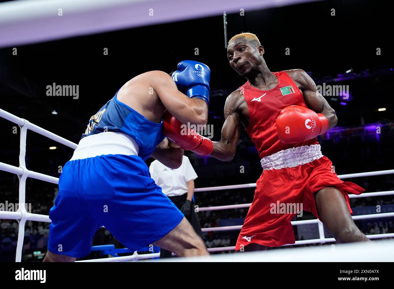 Zambia's Patrick Chinyemba, right, fights India's Amit Amit in their ...
