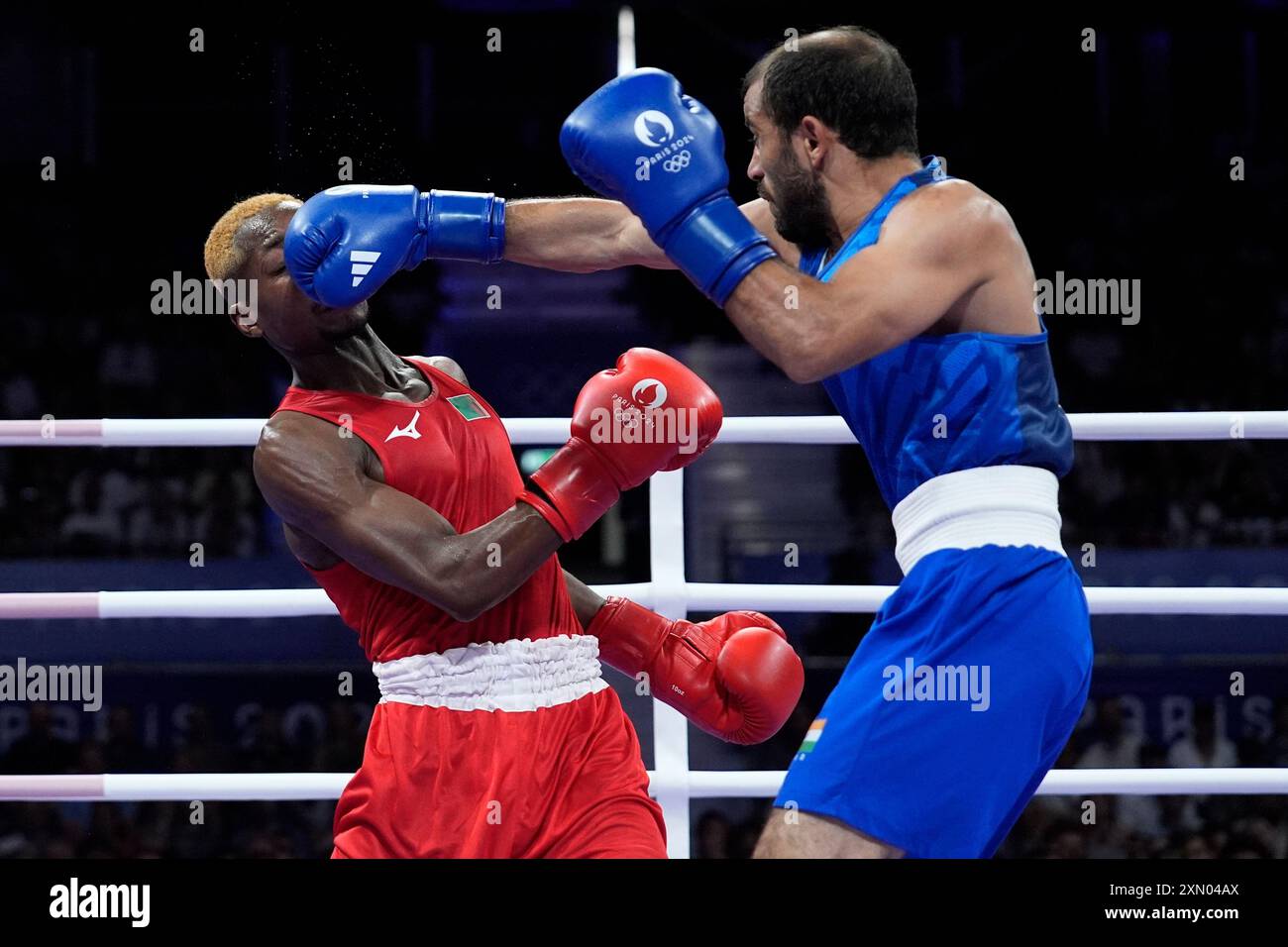 Zambia's Patrick Chinyemba, left, fights India's Amit Amit in their ...