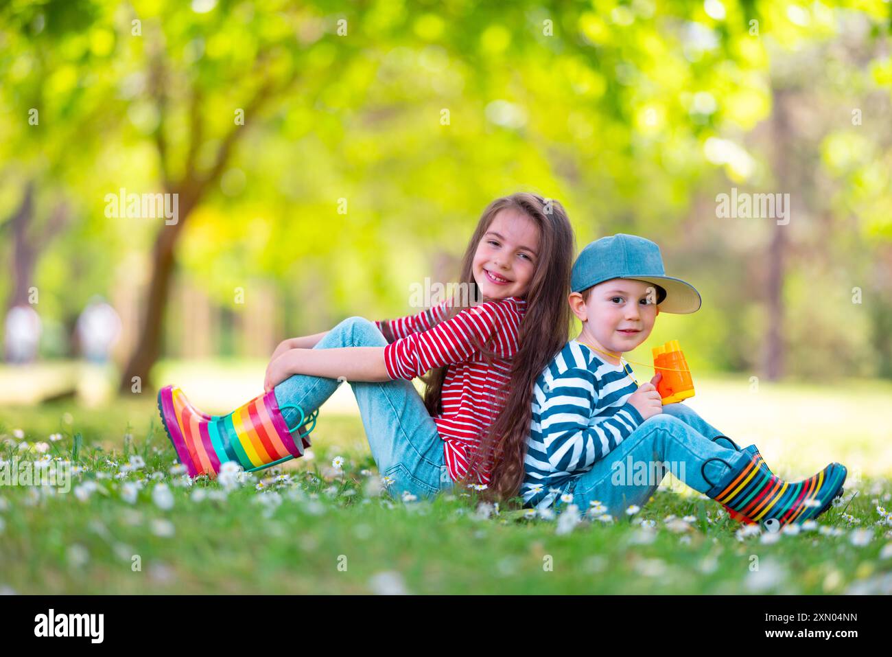 Girl and boy playing in garden hi-res stock photography and images - Alamy