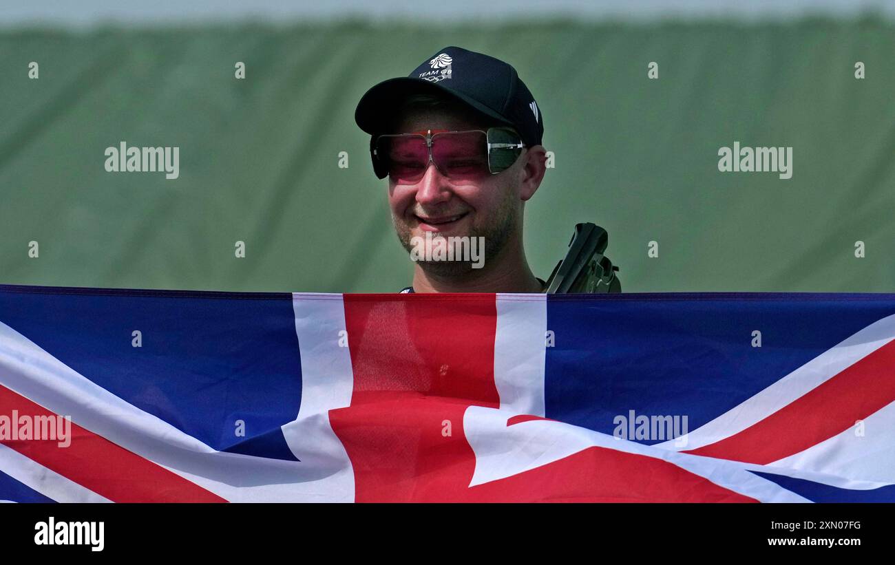 Britain's Nathan Hales holds the Union Jack as he poses for a ...