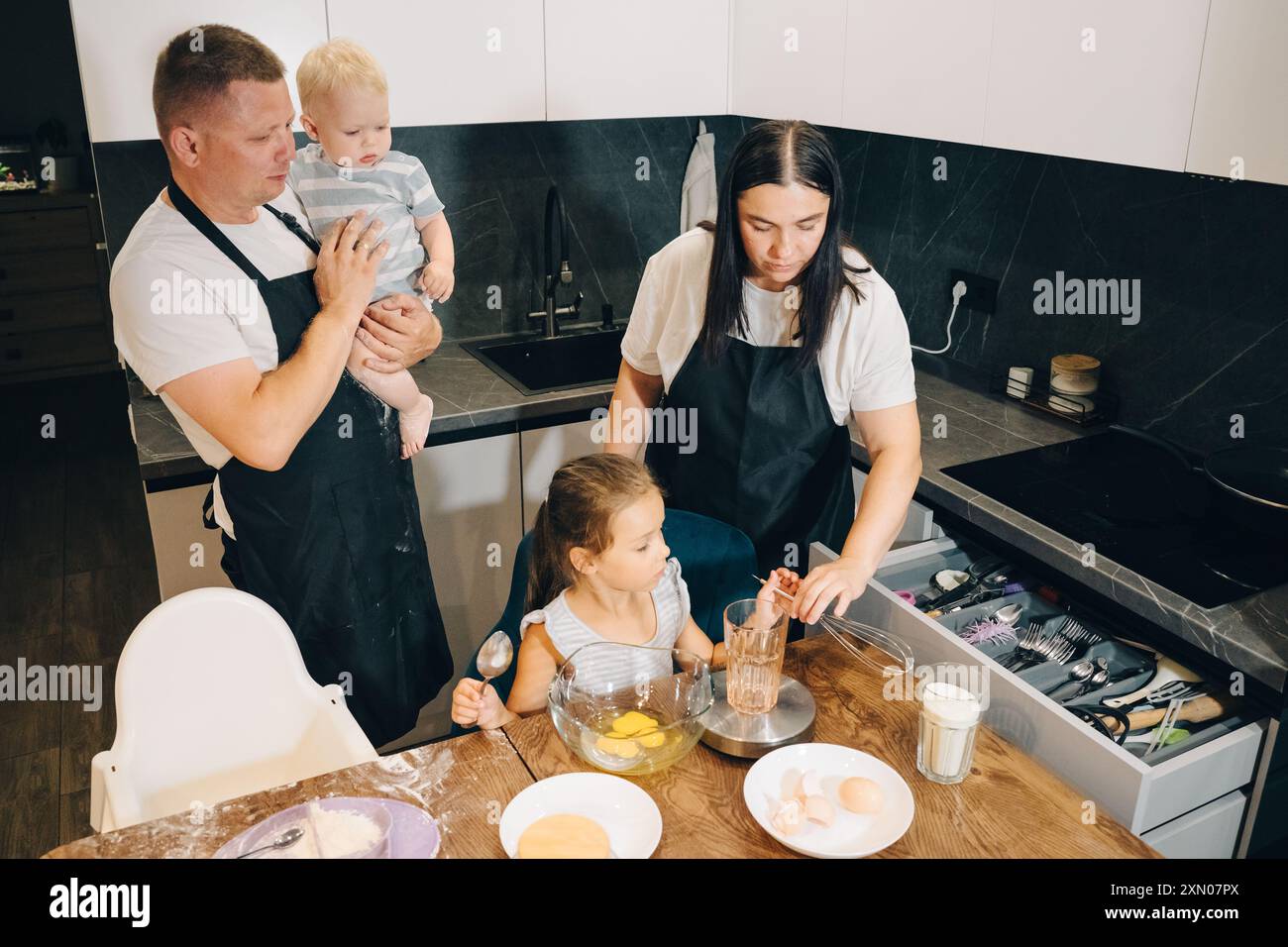 The Joy of Family Cooking Together in a Modern Kitchen Setting for ...