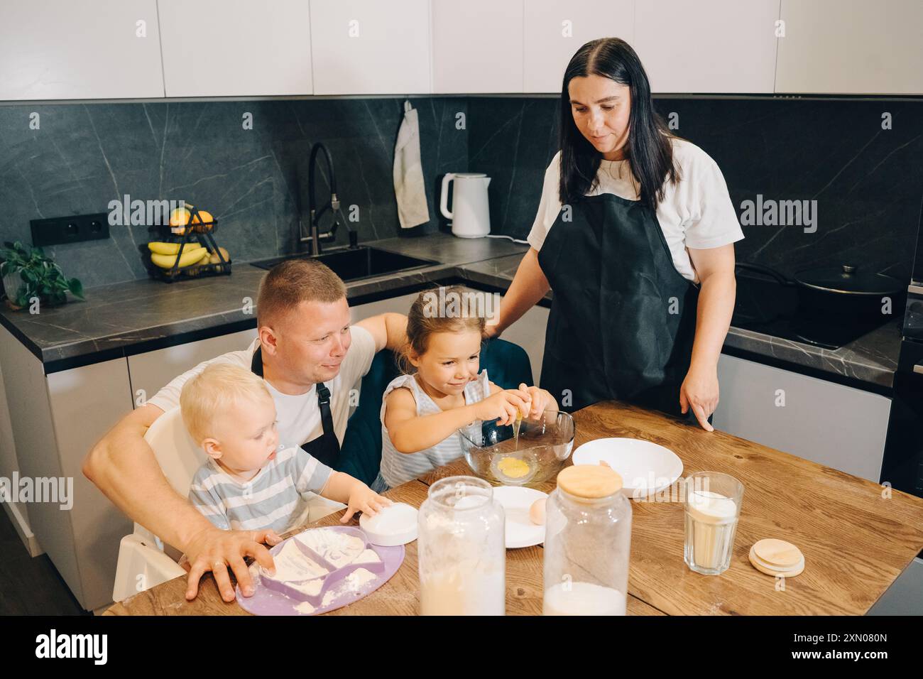 Engaging in Family Cooking Together in the Spacious and Modern Kitchen ...