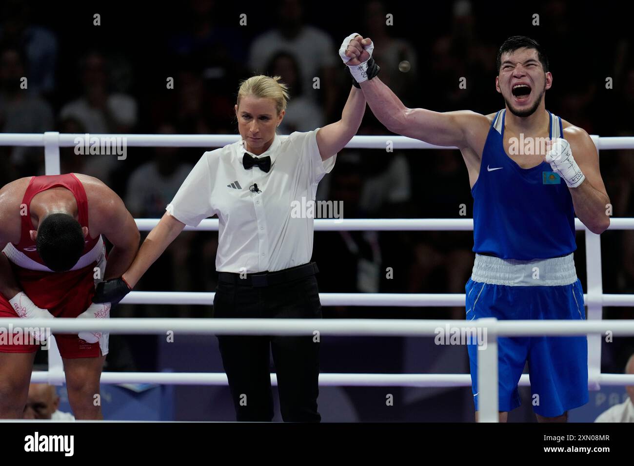 Kazakhstan's Nurbek Oralbay, right, celebrates after defeating ...