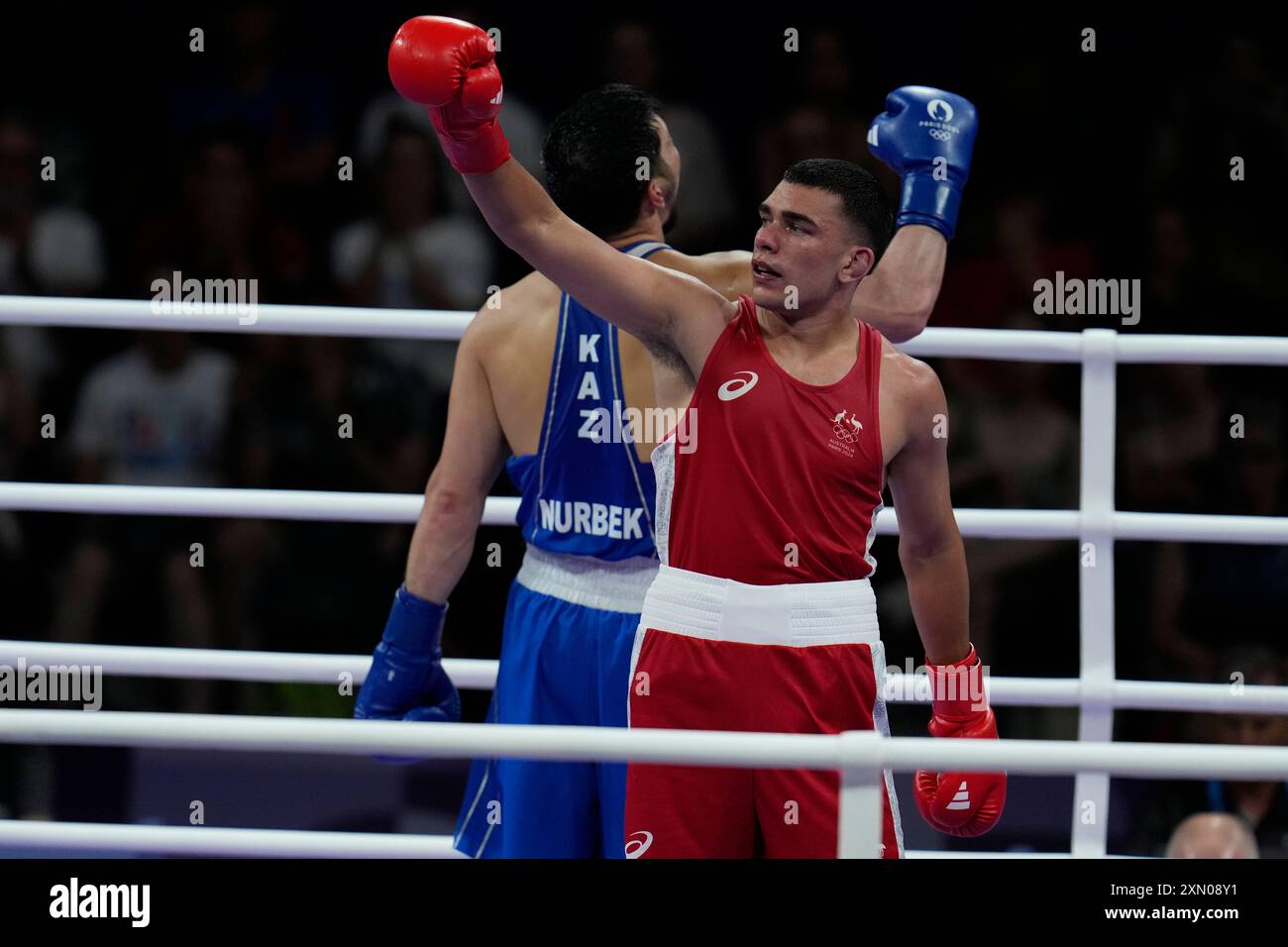 Kazakhstan's Nurbek Oralbay, blue, and Australia's Callum Peters, red ...