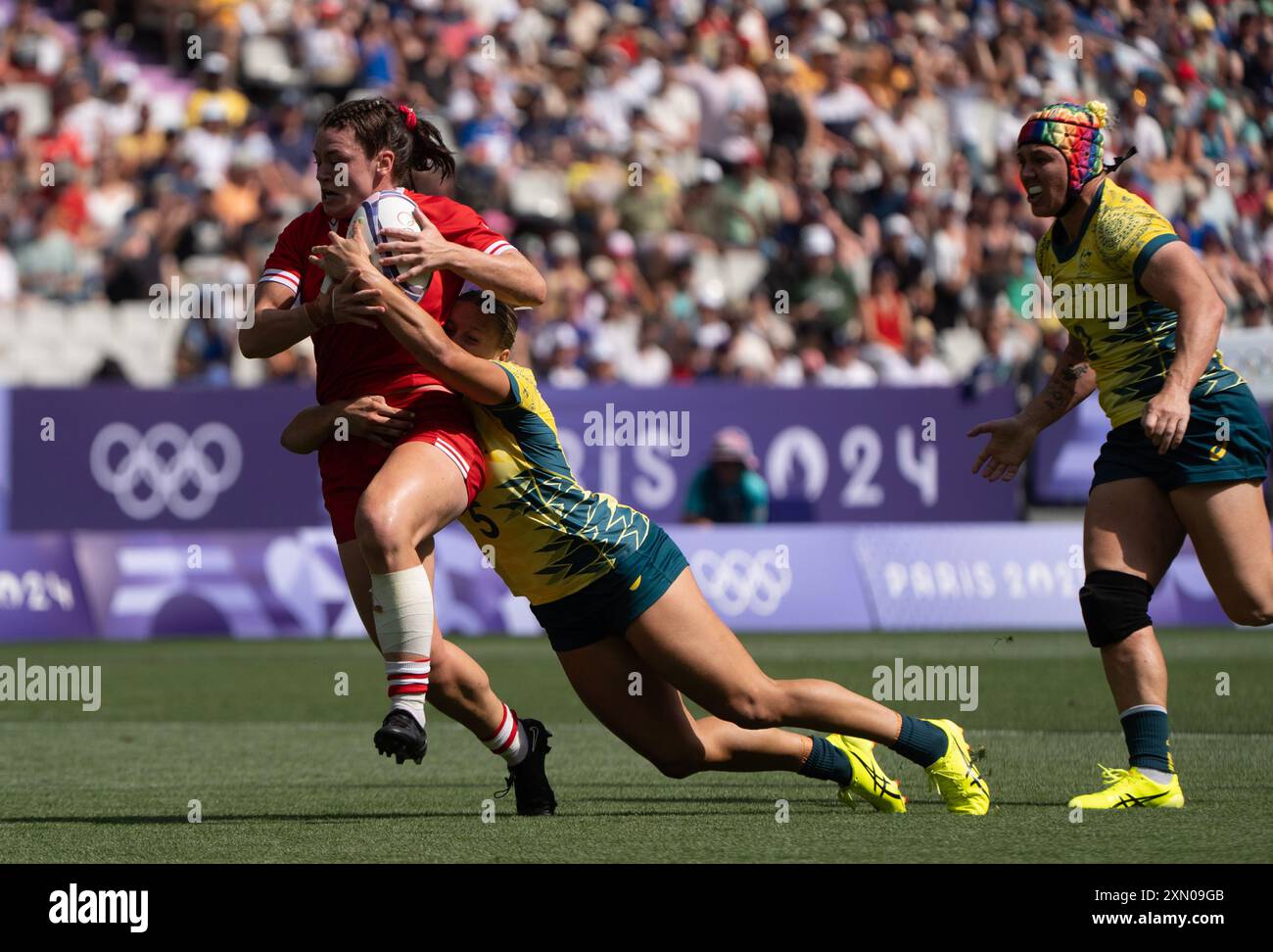Paris, France. 30th July, 2024. Australia's Teagan Levi tackles Canada ...