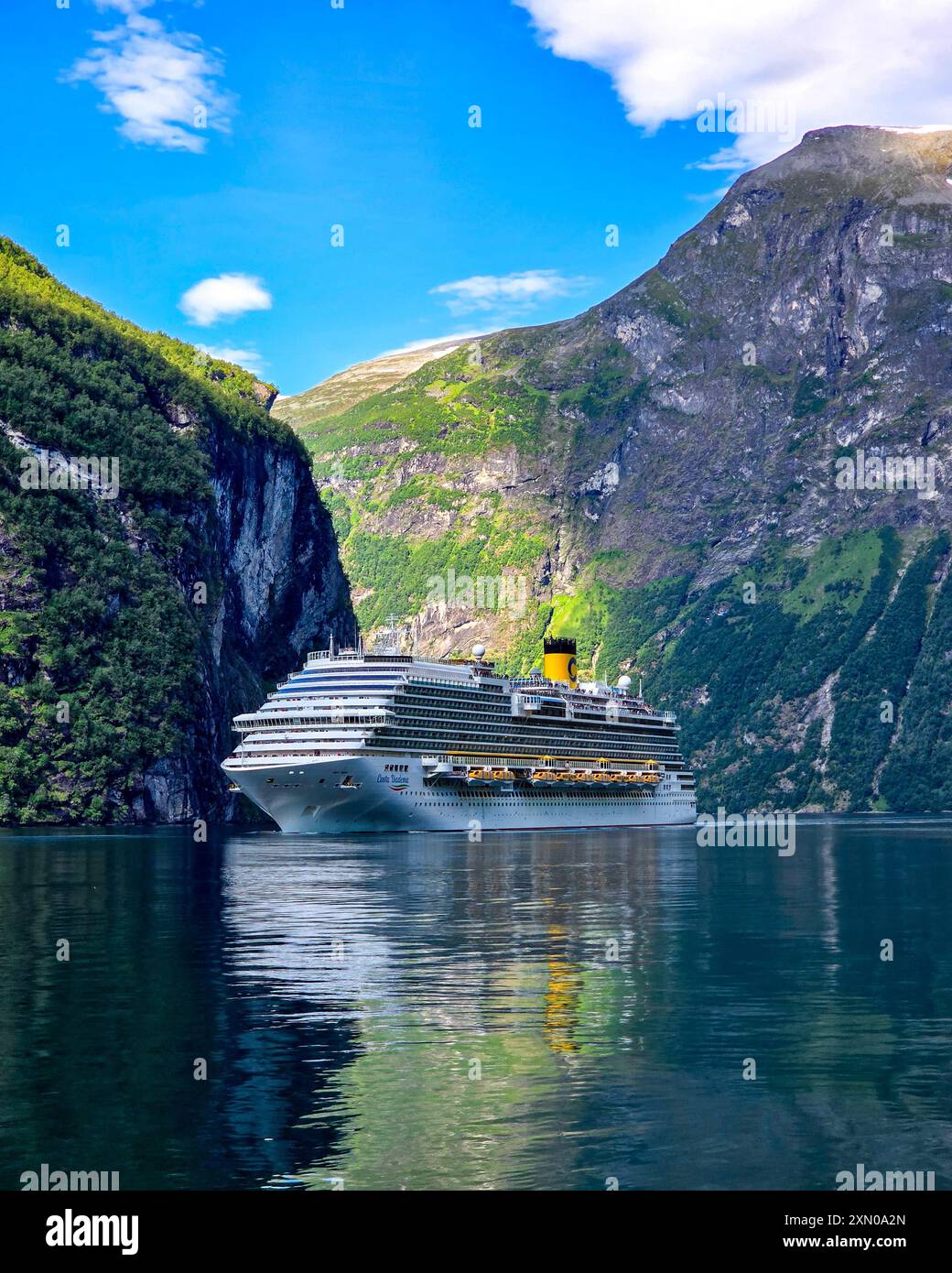 Geiranger Fjord Norway 10 July 2024, A grand cruise ship navigates the ...