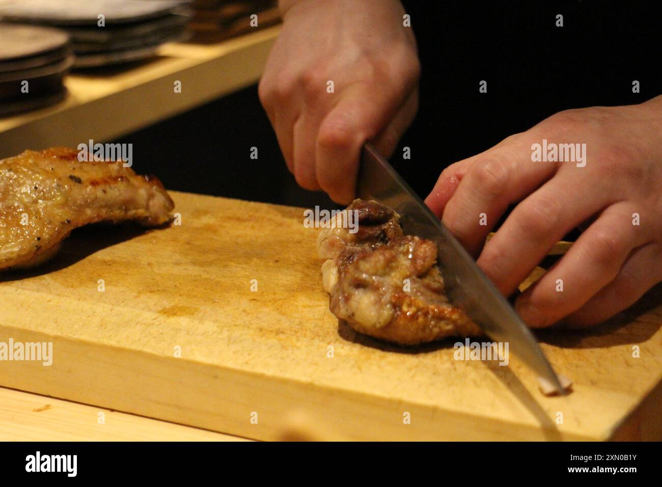 Cooking scene of Japanese cuisine (charcoal grilled chicken) in Kyoto ...