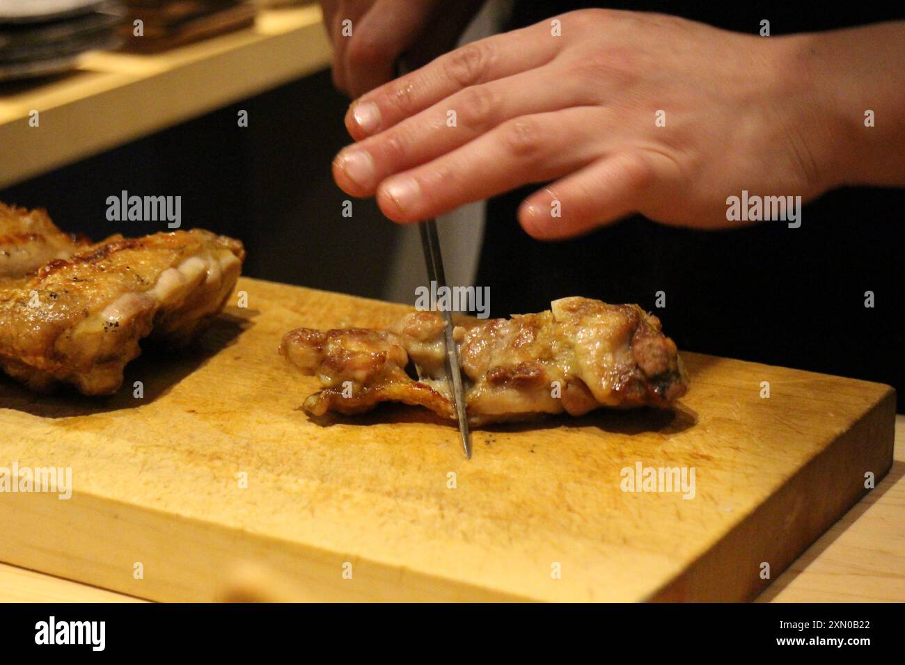 Cooking scene of Japanese cuisine (charcoal grilled chicken) in Kyoto ...