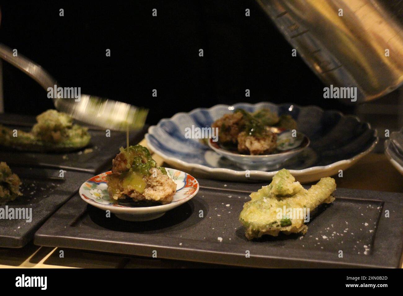 Cooking scene of Japanese cuisine (blowfish tempura) in Kyoto, Japan ...