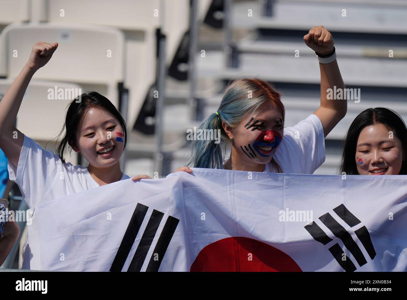 Korean archery fan poses for a photograph during the Archery individual ...