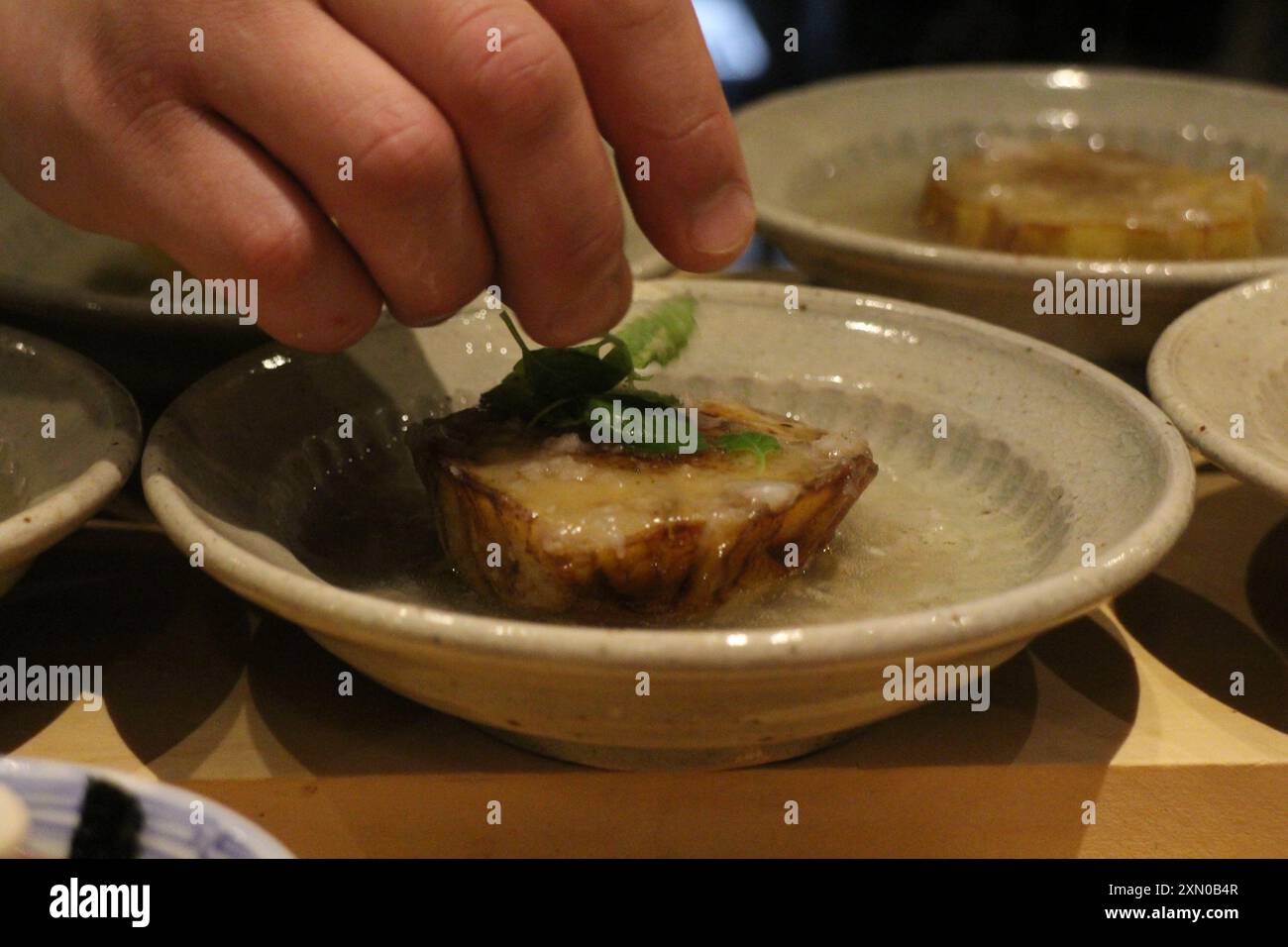 Cooking scene of Japanese cuisine (eggplant dengaku with grated daikon ...