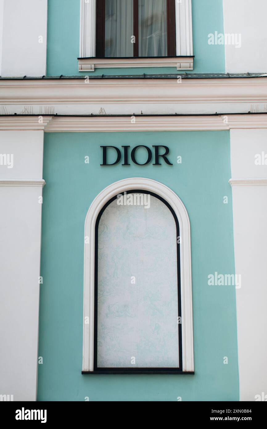 Turquoise facade of fashion boutique with Dior logo. Christian Dior is ...