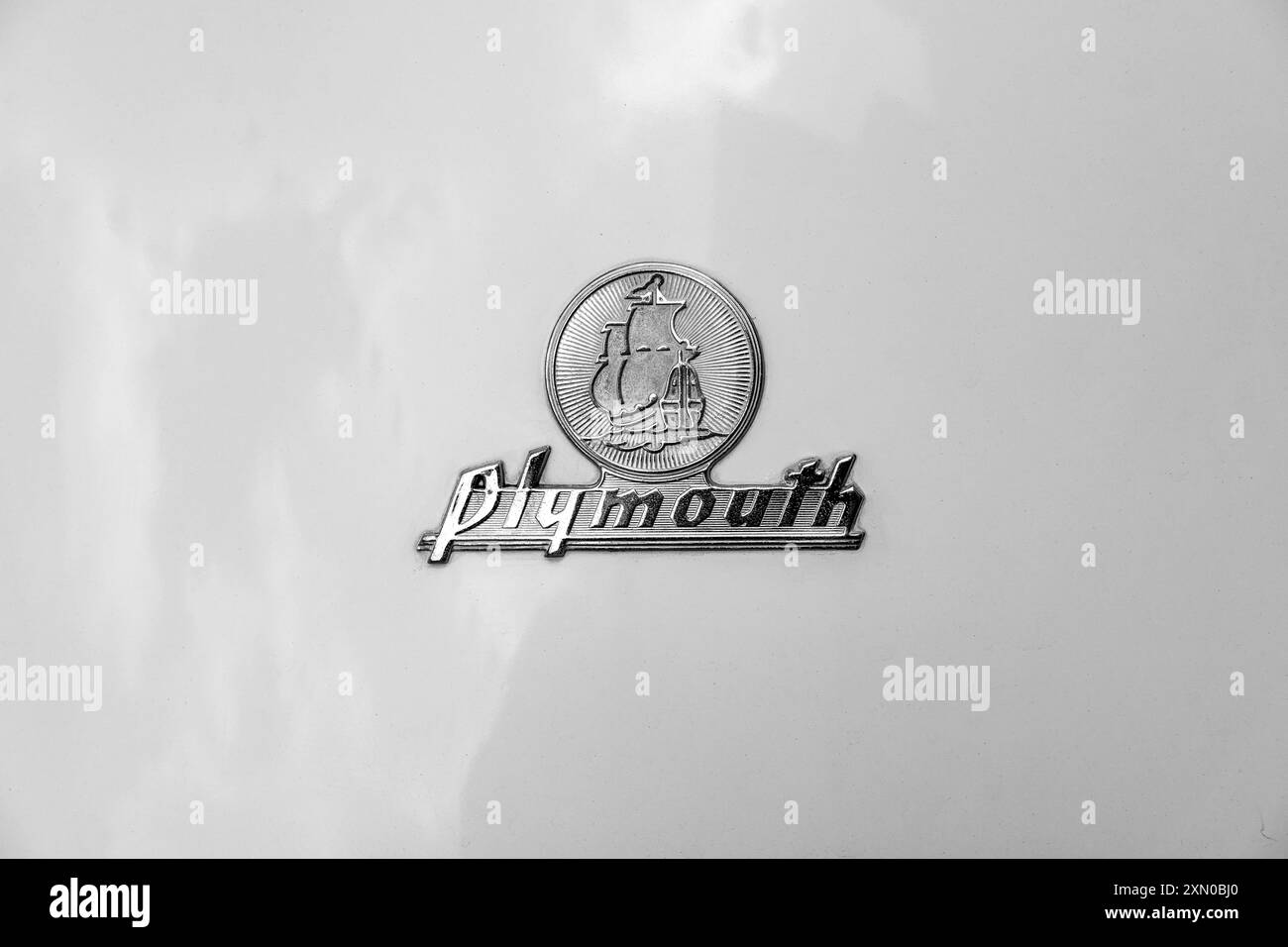 Plymouth motor car badge with ship emblem Stock Photo - Alamy