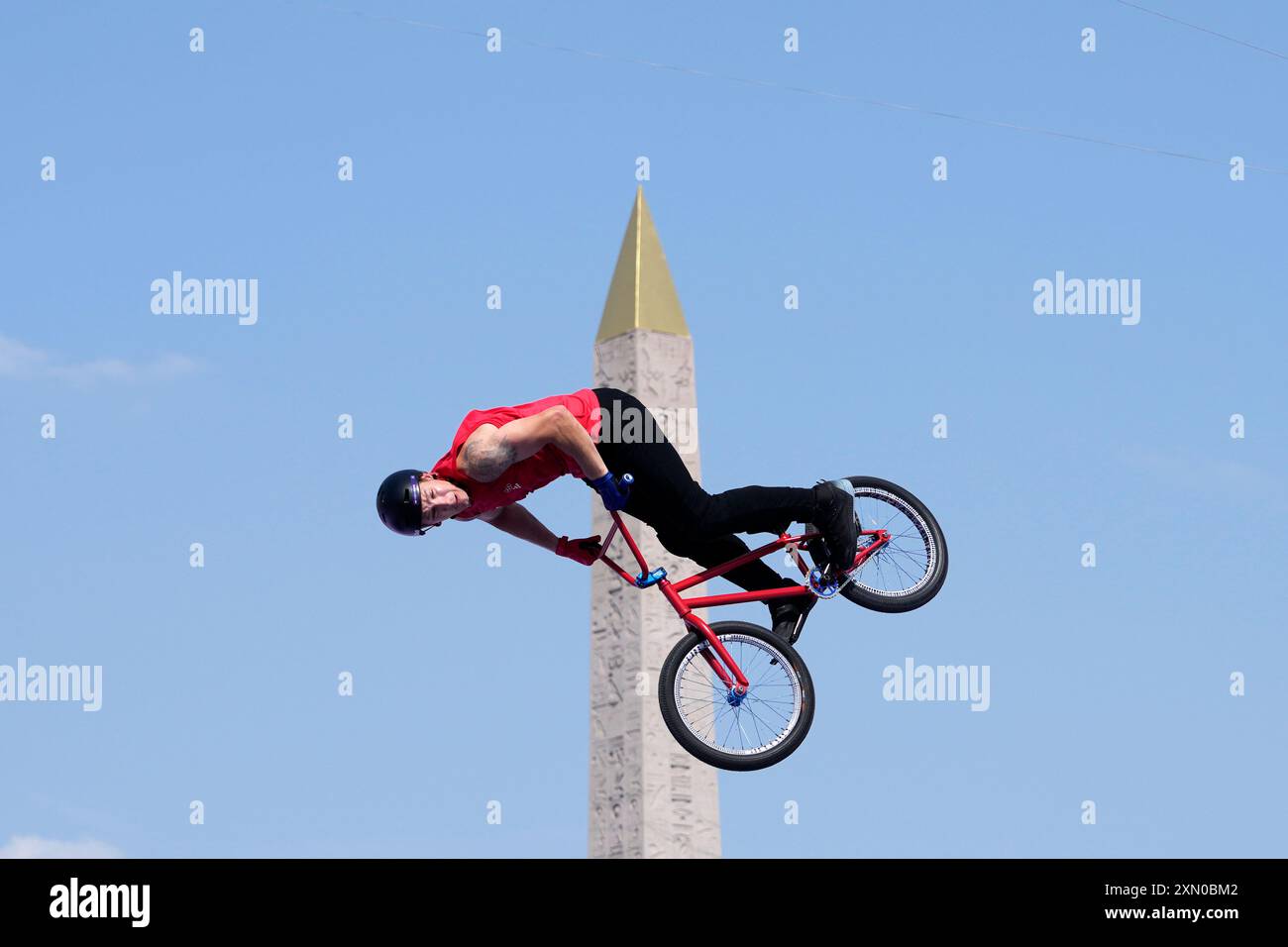 Marin Rantes, of Croatia, performs a trick, with the Luxor Obelisk of ...