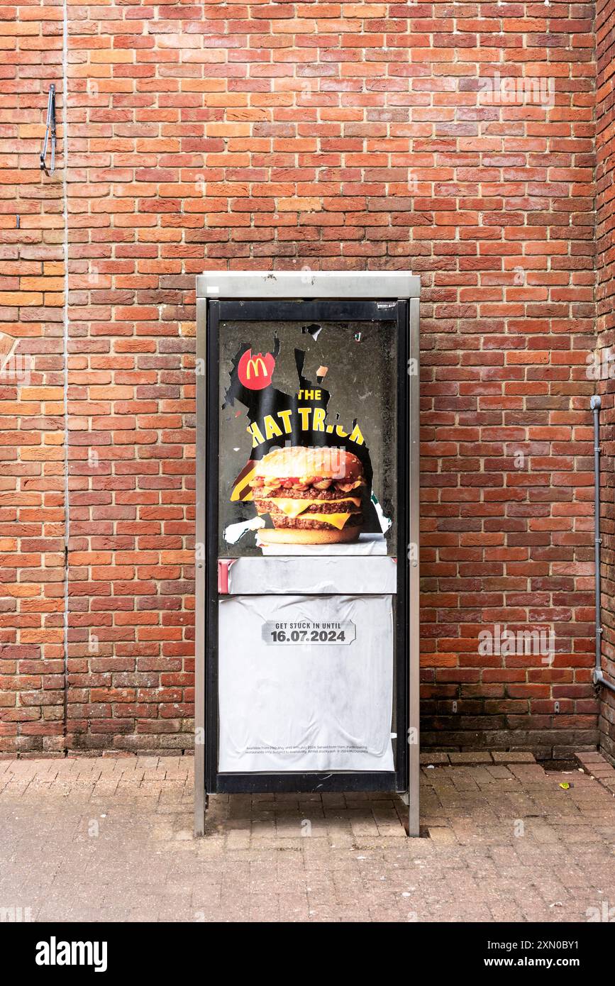 Peeling telephone box advertising poster Stock Photo - Alamy