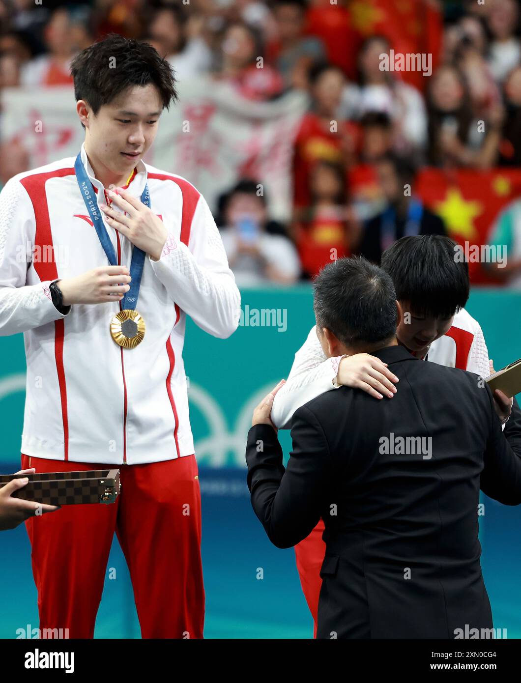 Paris, France. 30th July, 2024. Gold medalists Wang Chuqin (L)/Sun ...