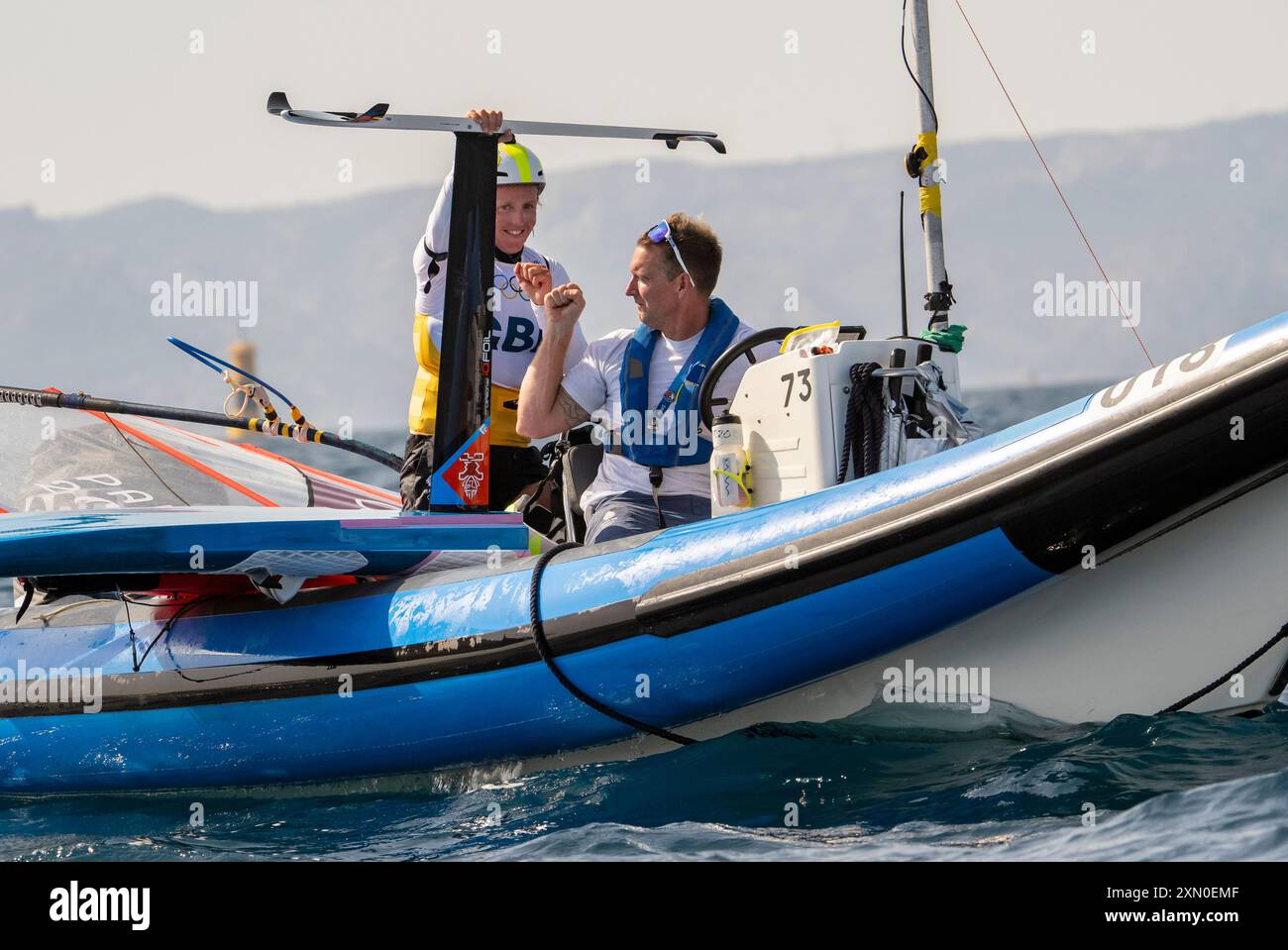 Britain's Emma Wilson gets a fist bump from coach Sam Ross after ...