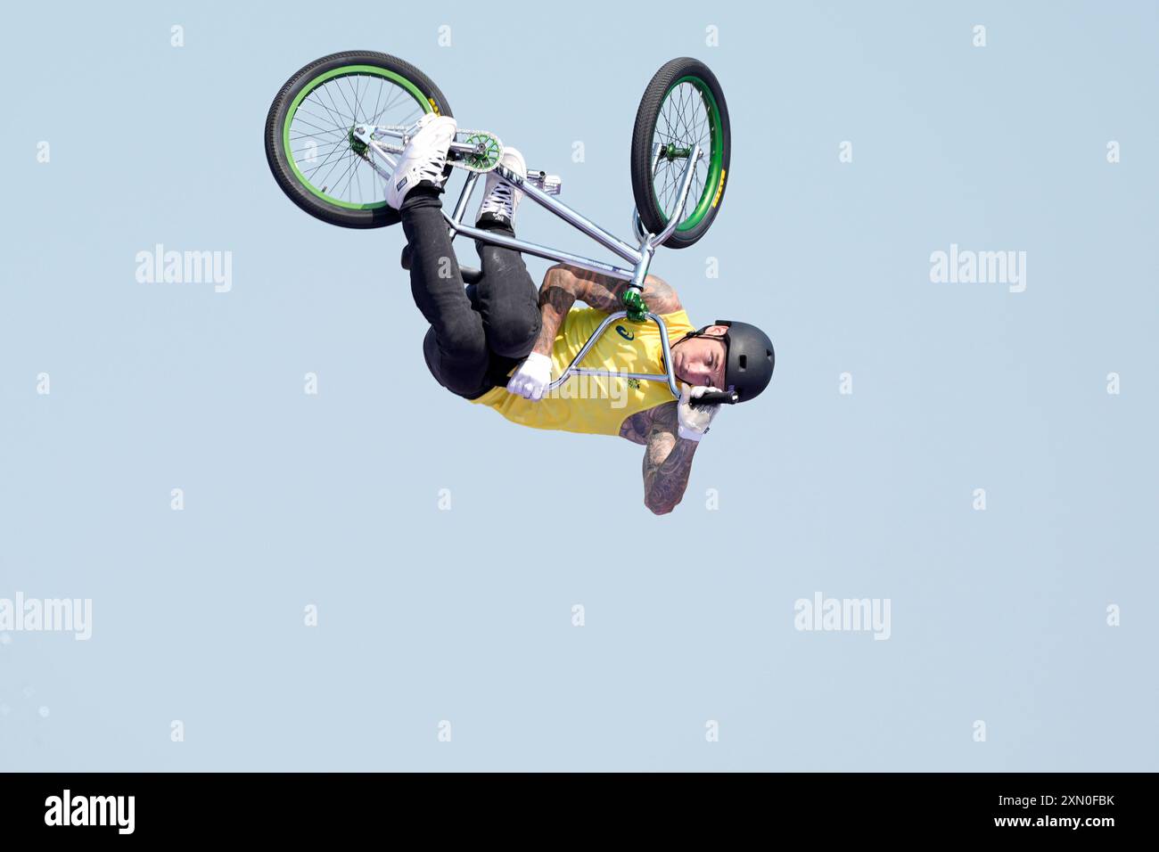 Logan Martin, of Australia, performs a trick during the cycling BMX ...