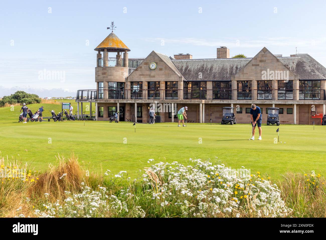 Golfers on the practice putting green outside Pilmour House, the ...