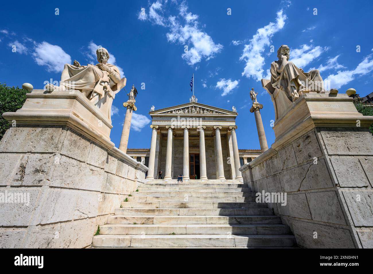 Statues of Plato and Socrates look down above the entranceway to the ...