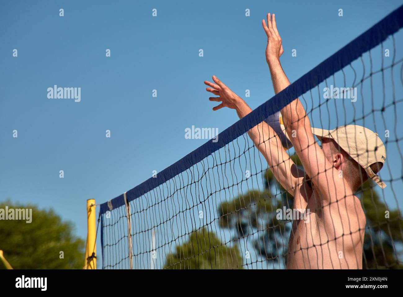 In an intense moment during the 3x3 Ladeira Beach Volleyball Tournament ...