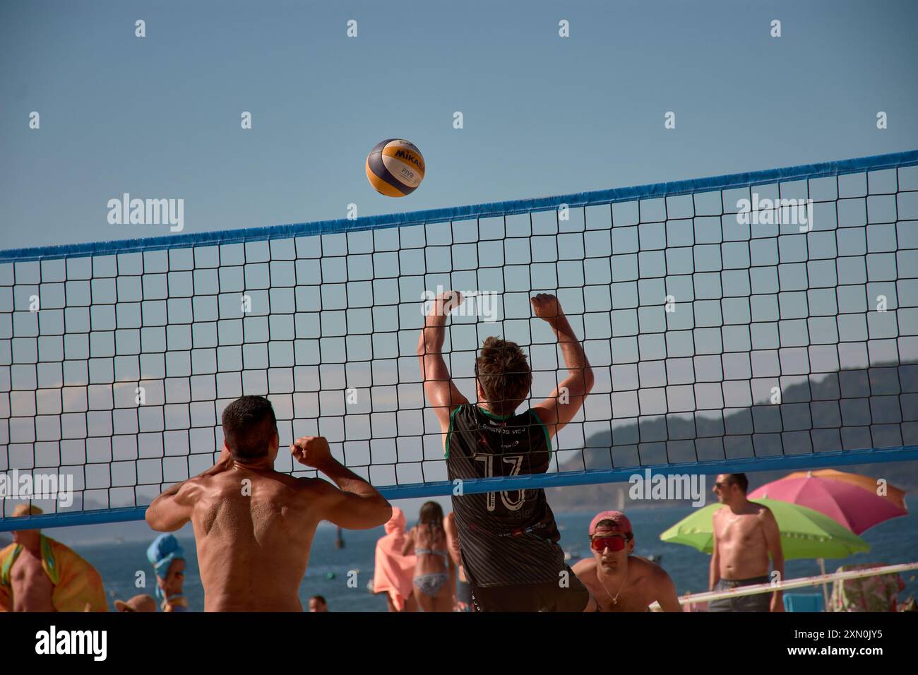 In an intense moment during the 3x3 Ladeira Beach Volleyball Tournament ...