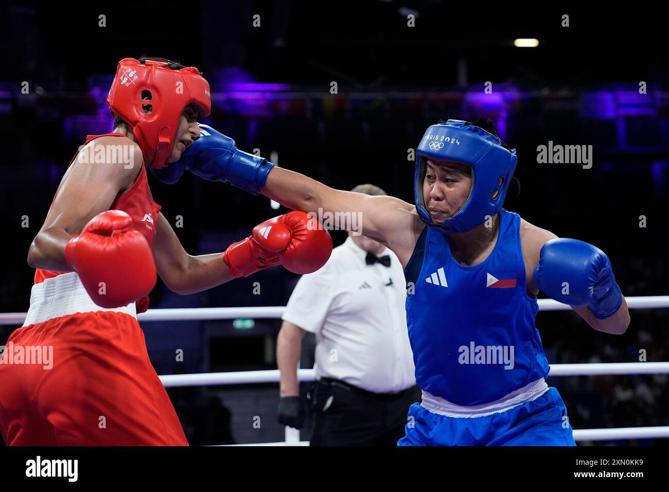 India's Jaismine, left, fights Philippines' Nesthy Petecio in their preliminary women's 57kg ...
