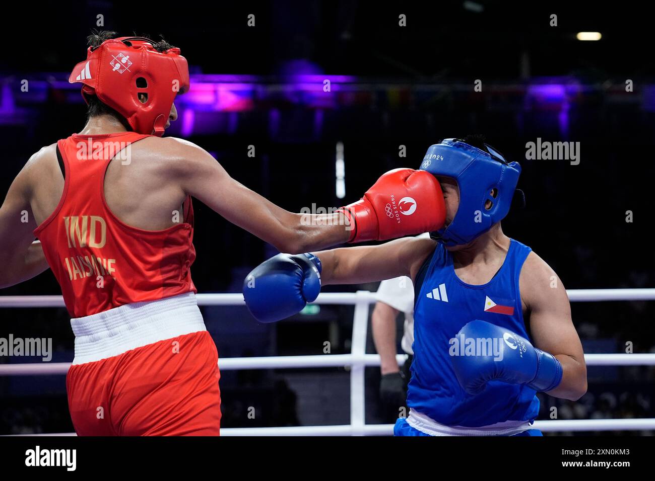 India's Jaismine, left, fights Philippines' Nesthy Petecio in their preliminary women's 57kg ...