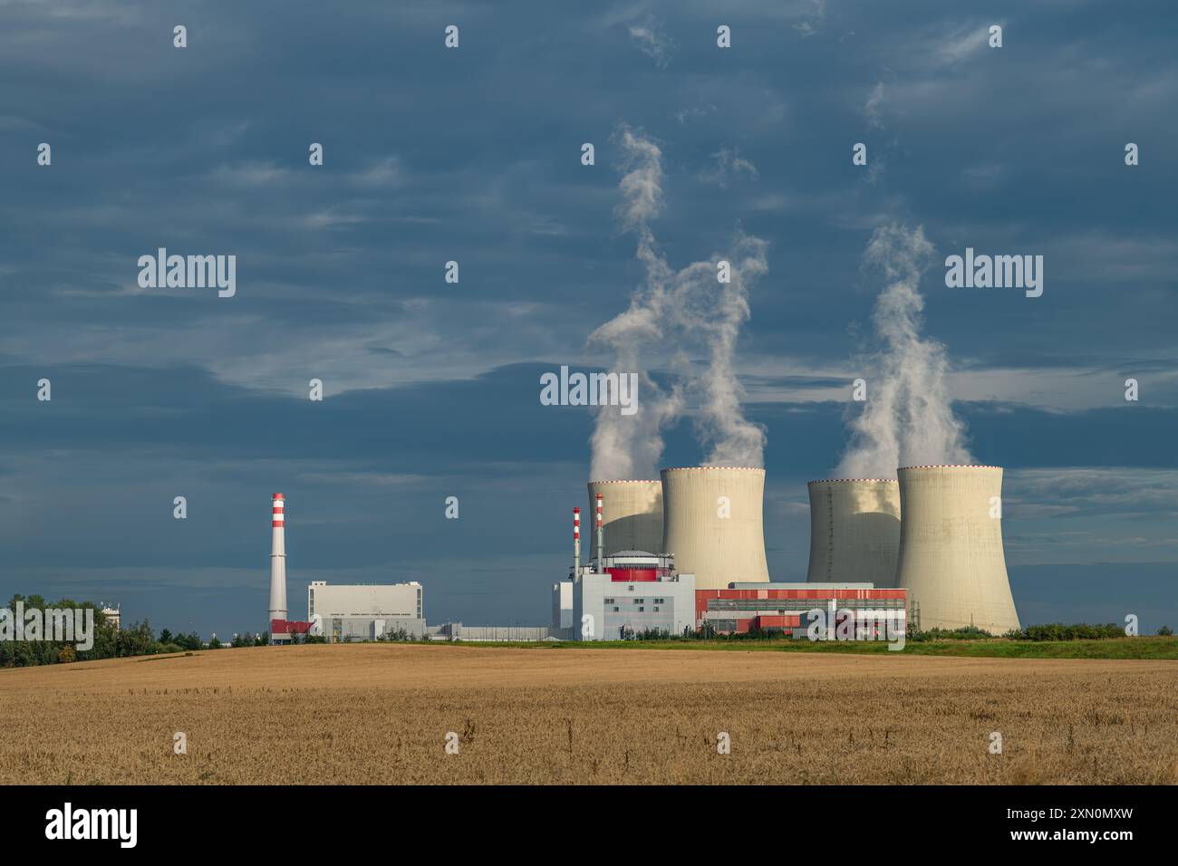 Nuclear power plant with grain fields in summer hot evening in Temelin ...
