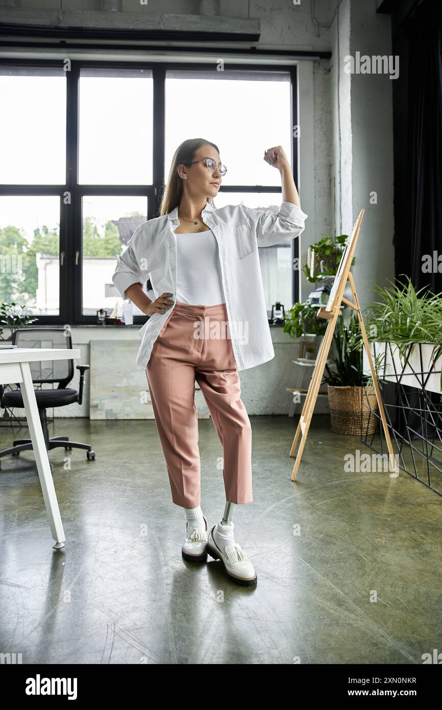 Woman with prosthetic leg in modern loft, wearing white shirt and pink ...