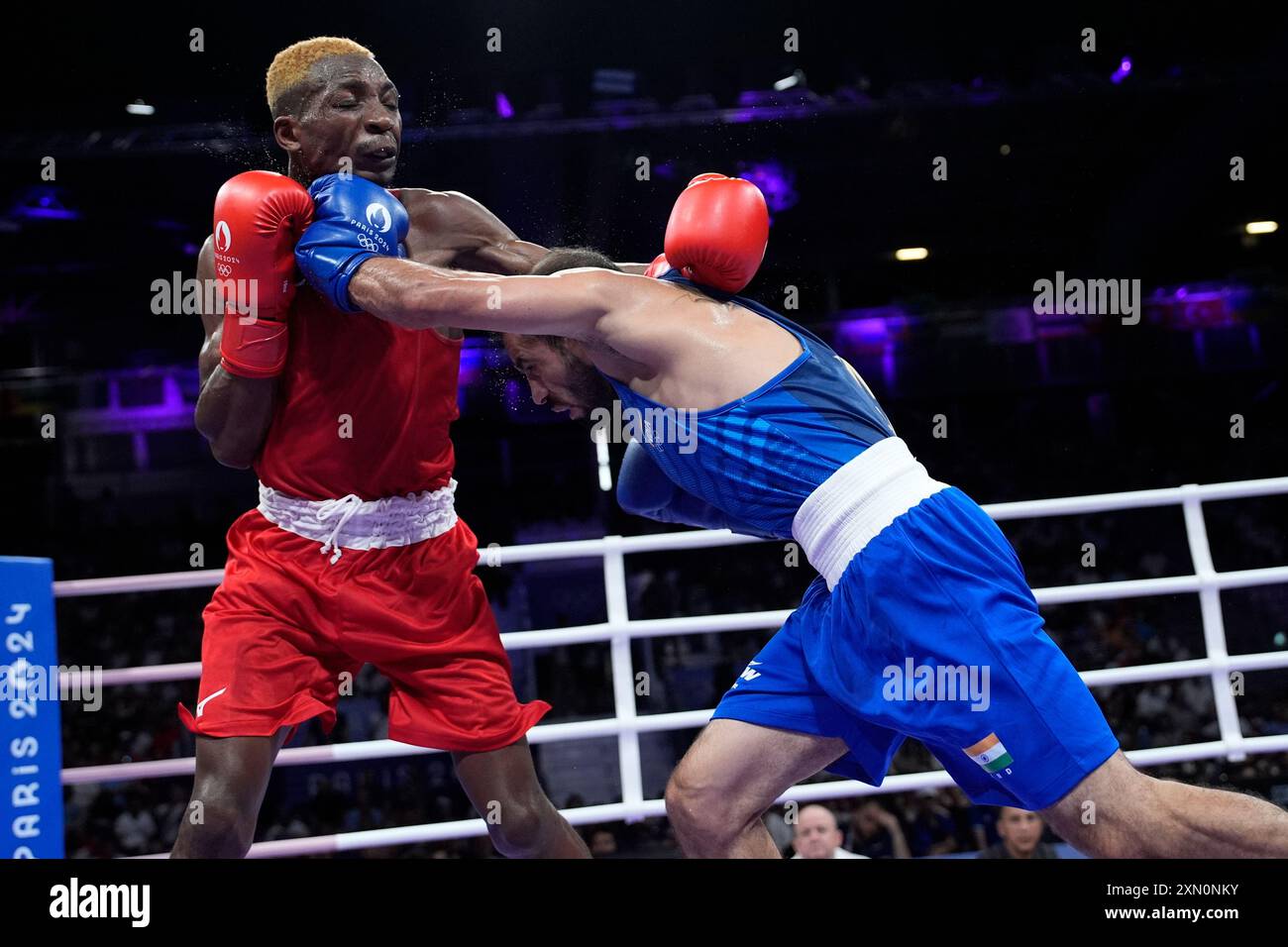 Zambia's Patrick Chinyemba, left, fights India's Amit Amit in their ...
