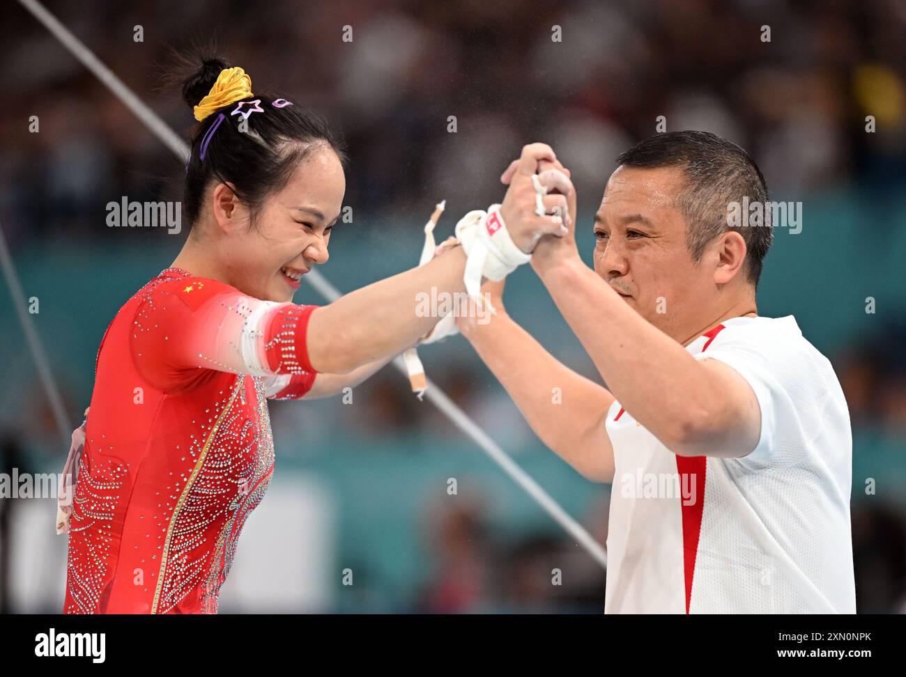 Paris, France. 30th July, 2024. Luo Huan (L) of team China reacts after ...