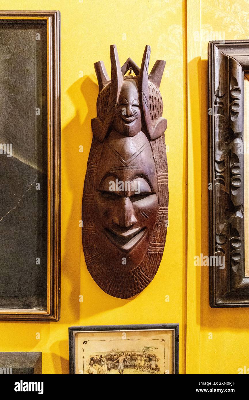 African mask hanging on the wall at the New Orleans Historic Voodoo ...
