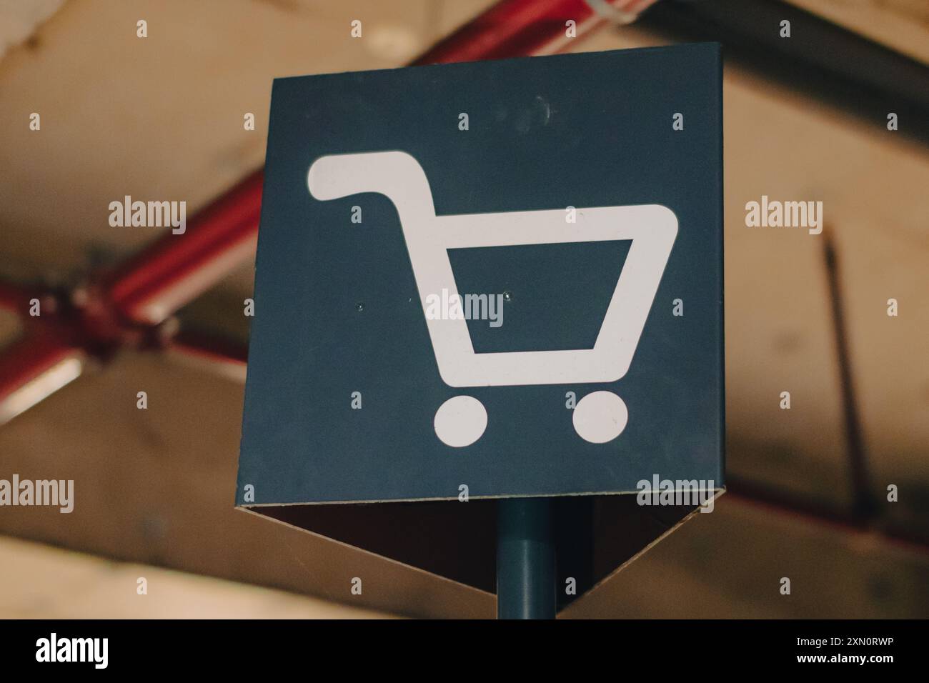 Shopping sign in a underground parking garage Stock Photo - Alamy