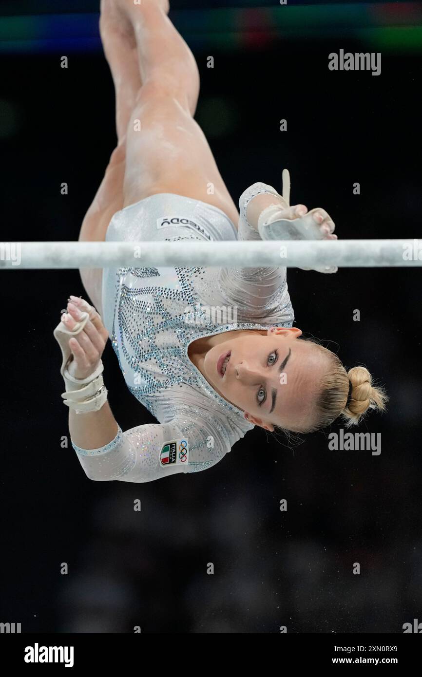 Alice D'Amato, of Italy, performs on the uneven bars during the women's ...