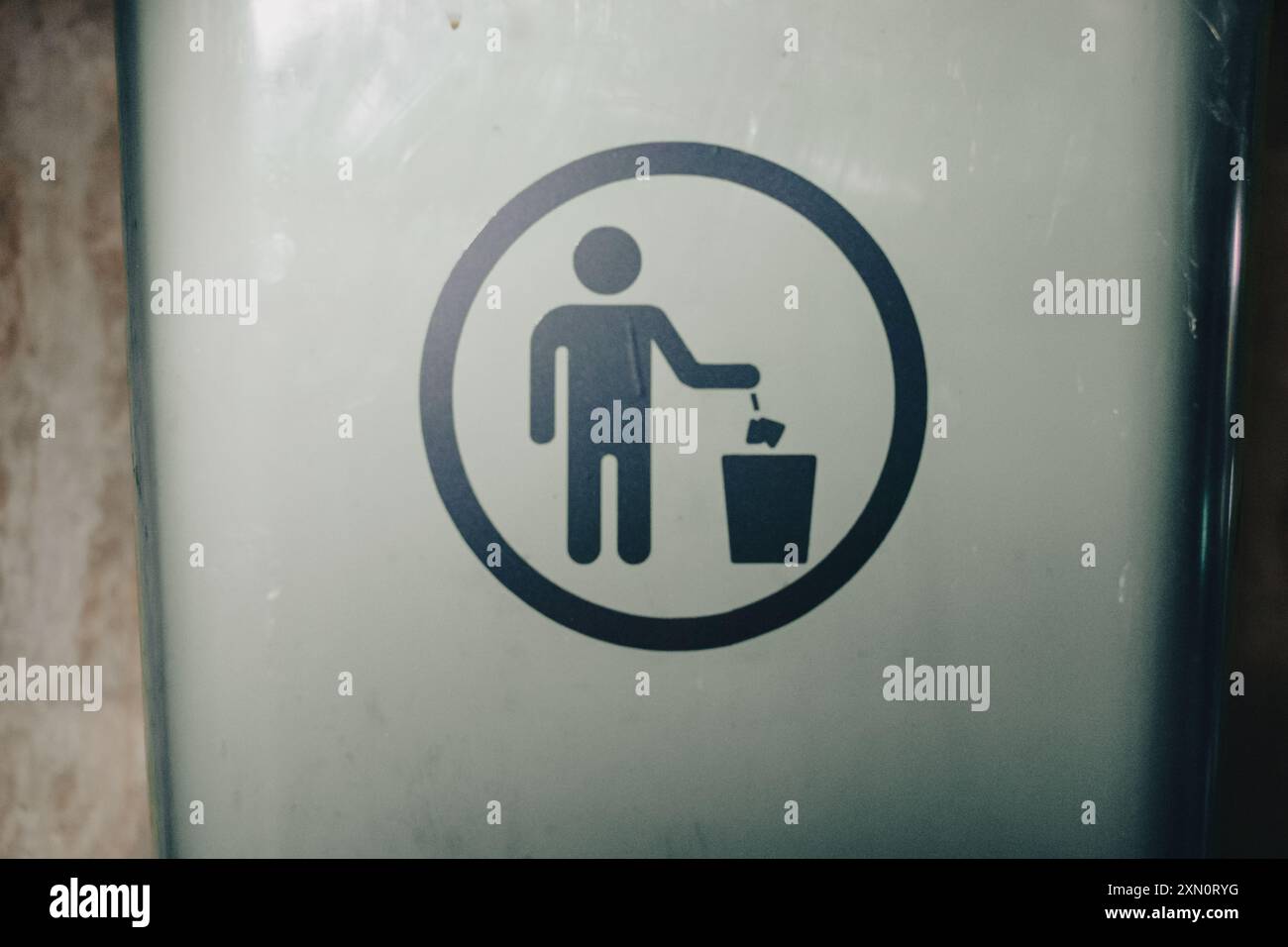 Garbage bin sign in a underground parking garage Stock Photo - Alamy