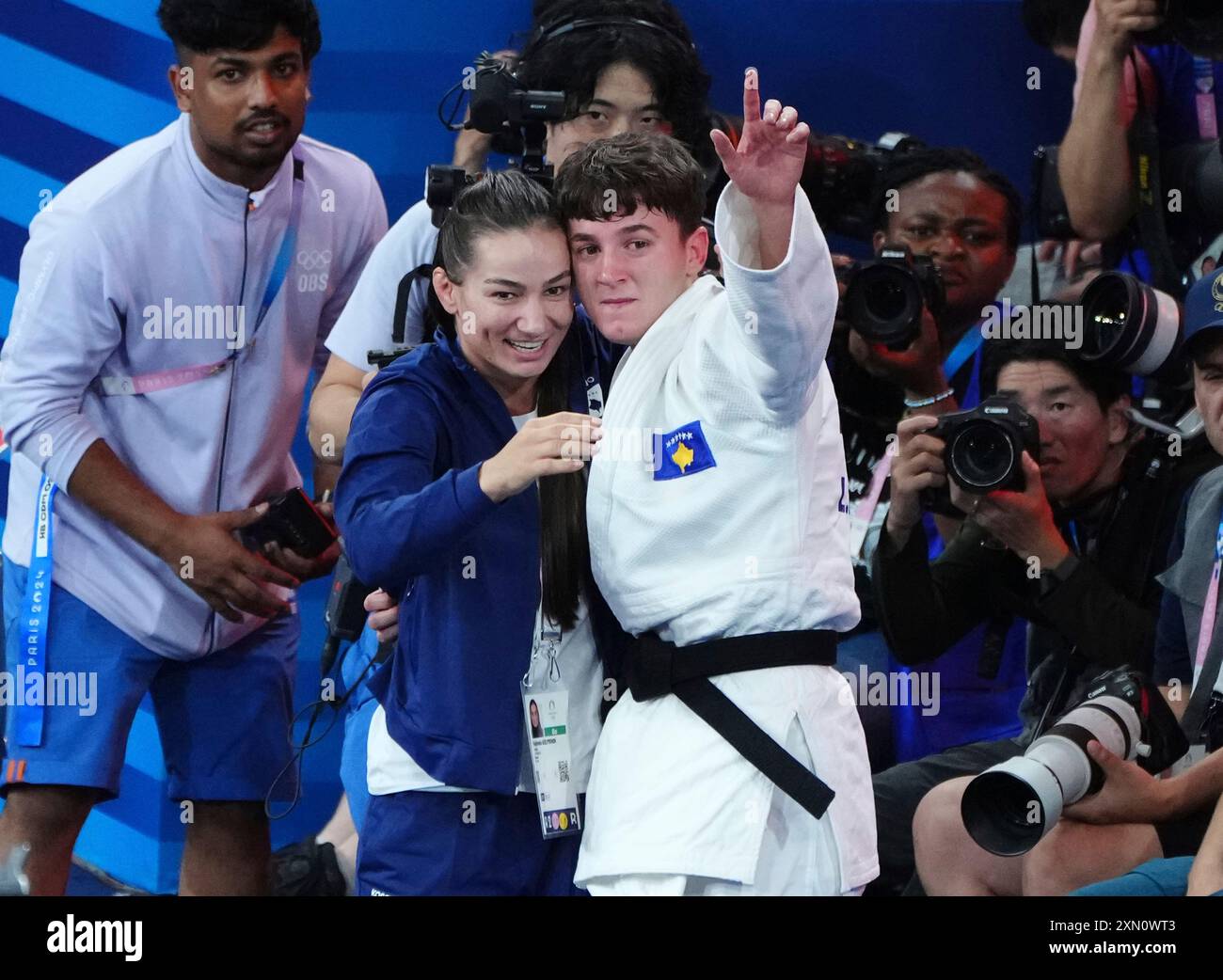 Kosovo's FAZLIU Laura (R) celebrates after the women's judo -63 kg ...